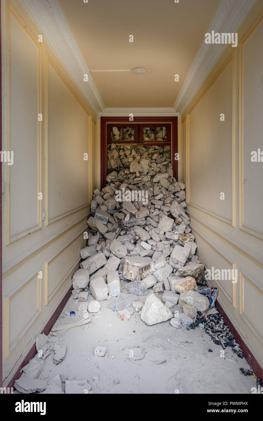 Accumulation of rubbles in the front entrance of a building being ...