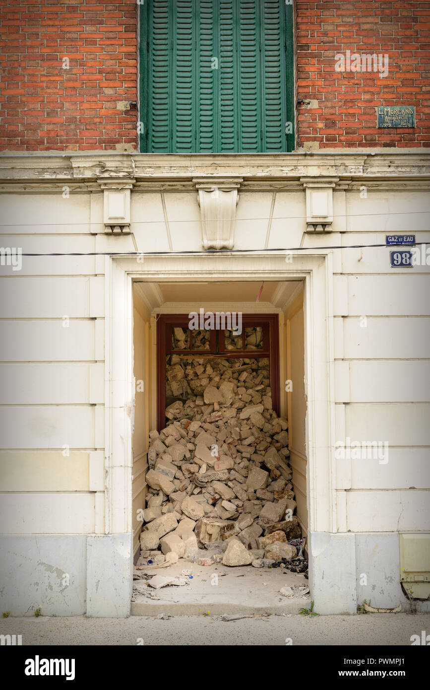 Accumulation of rubbles in the front entrance of a building being ...