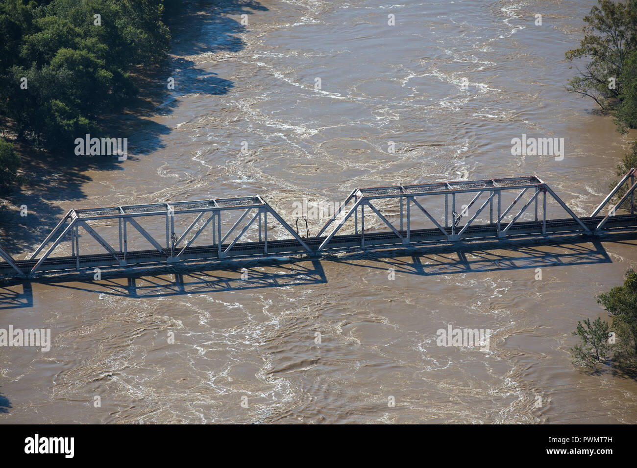 Flood waters overwhelm a railroad bridge across the Waccamaw River in ...