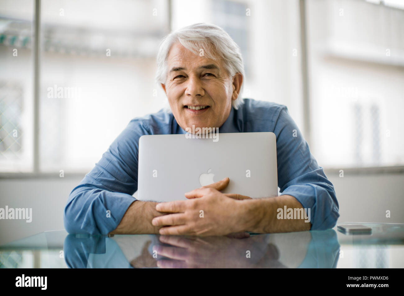 Businessman hugging his computer hi-res stock photography and images ...