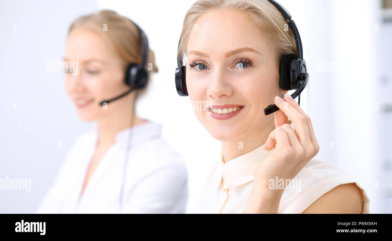 Bright call center office. Two blonde women in a headset Stock Photo ...