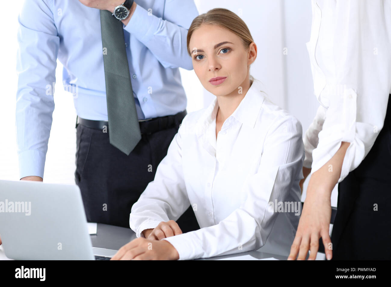 Group of business people using laptop computer in office. Meeting and ...