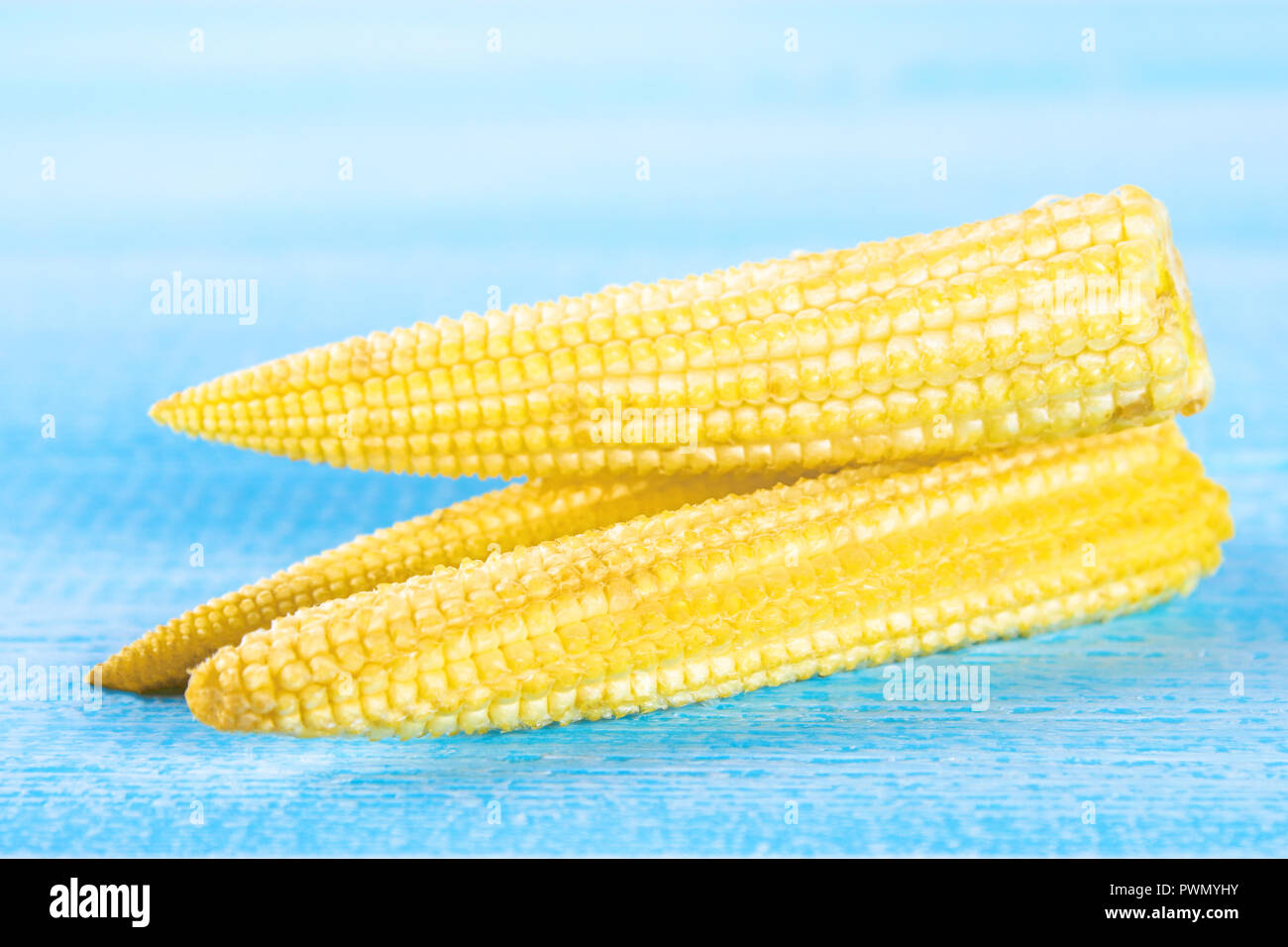 Baby sweetcorn or mini corn. It is typically the eaten whole cob ...
