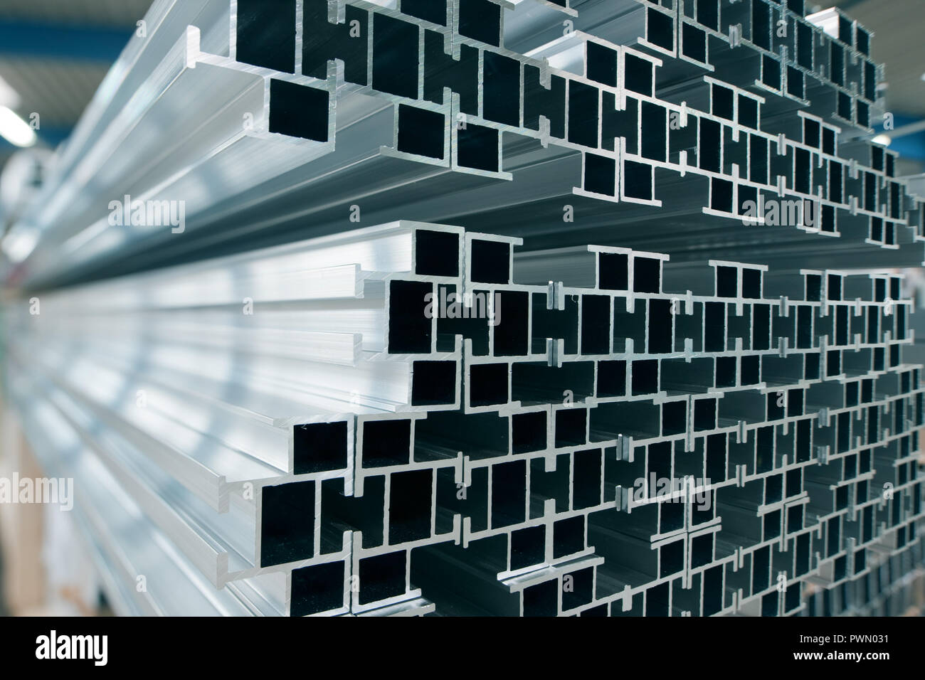 Aluminium Profiles stacked in a storage rack Stock Photo - Alamy