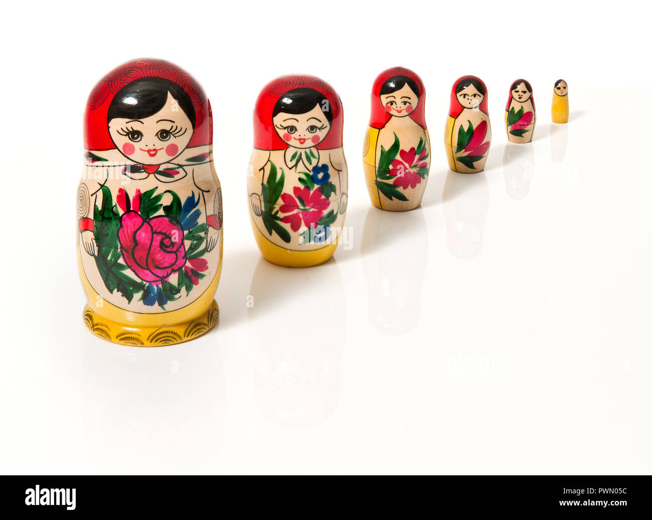 A decrescent row of Matrjoschka on white background Stock Photo - Alamy