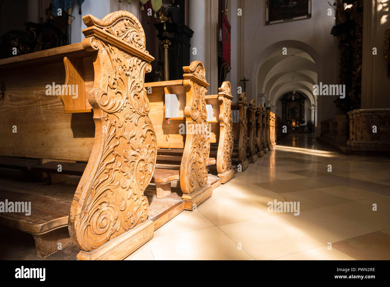 Mondsee, Austria - April 2, 2018: Row of carved wooden benches and ...