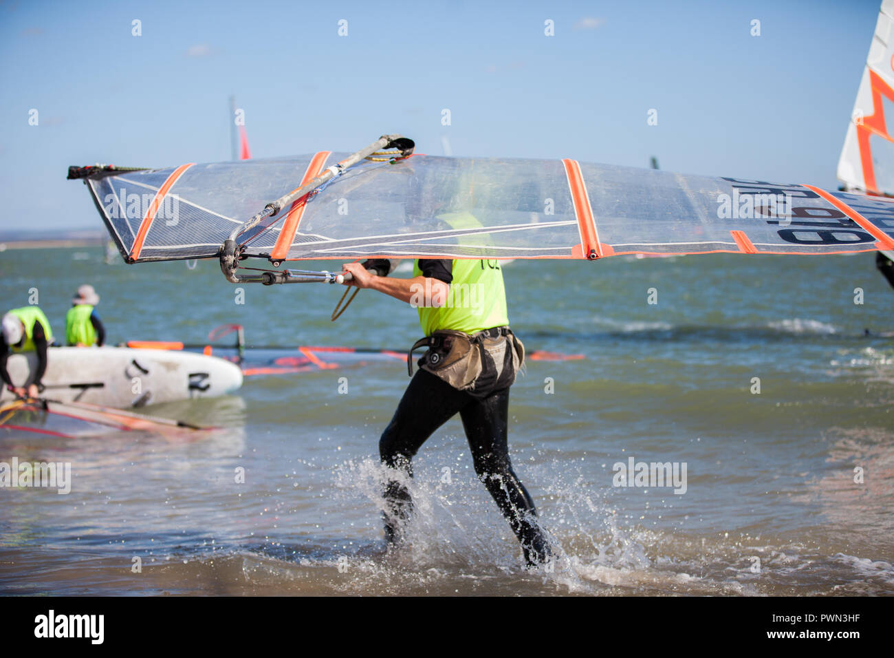 wind surfers getting ready for a race Stock Photo - Alamy