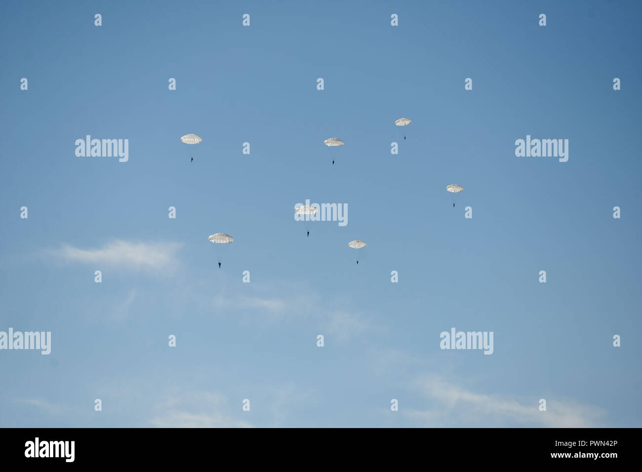 plane and jump from it parachutists in the sky Stock Photo - Alamy