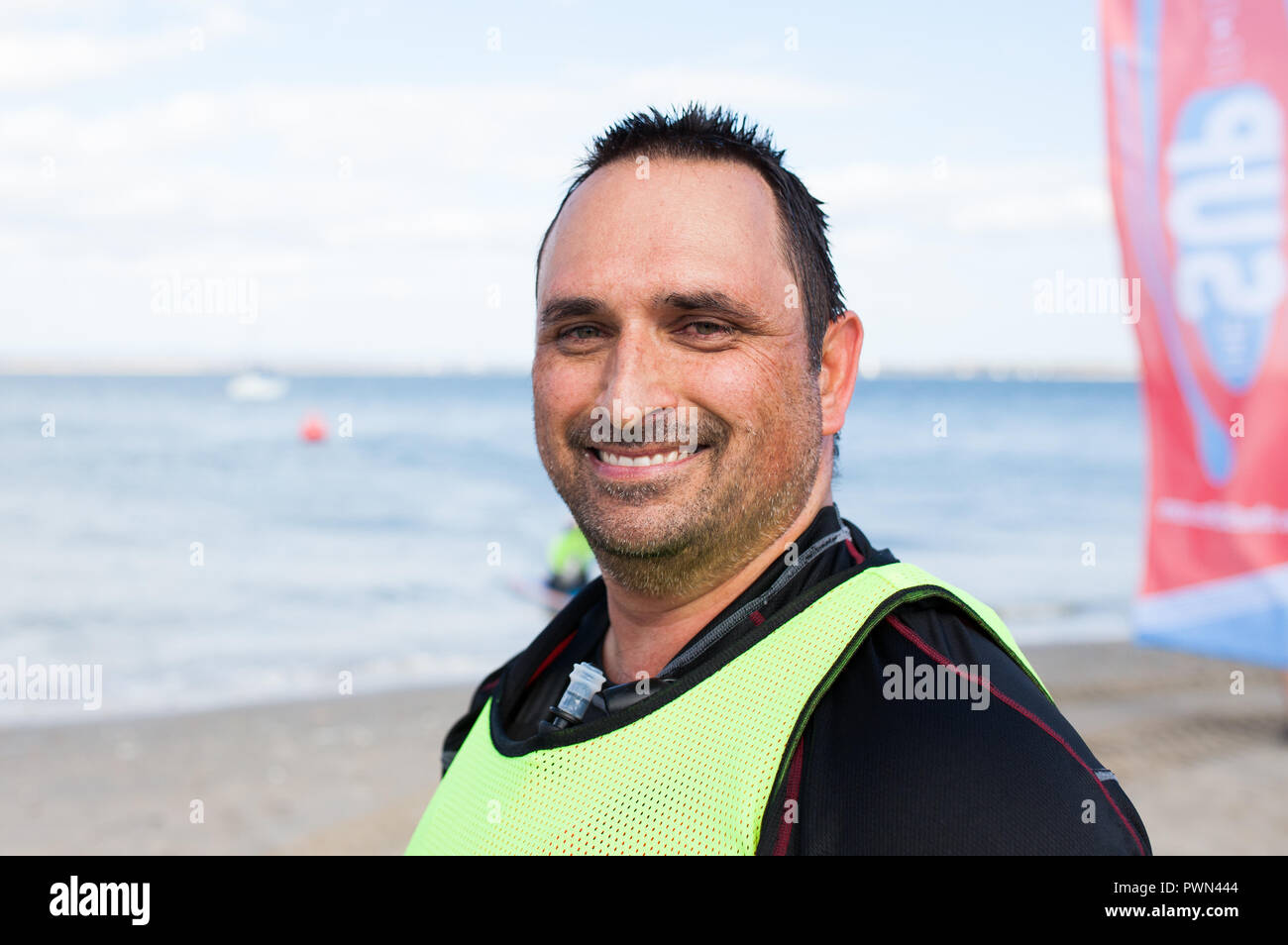 Portrait of a man after finishing a paddle board race Stock Photo - Alamy