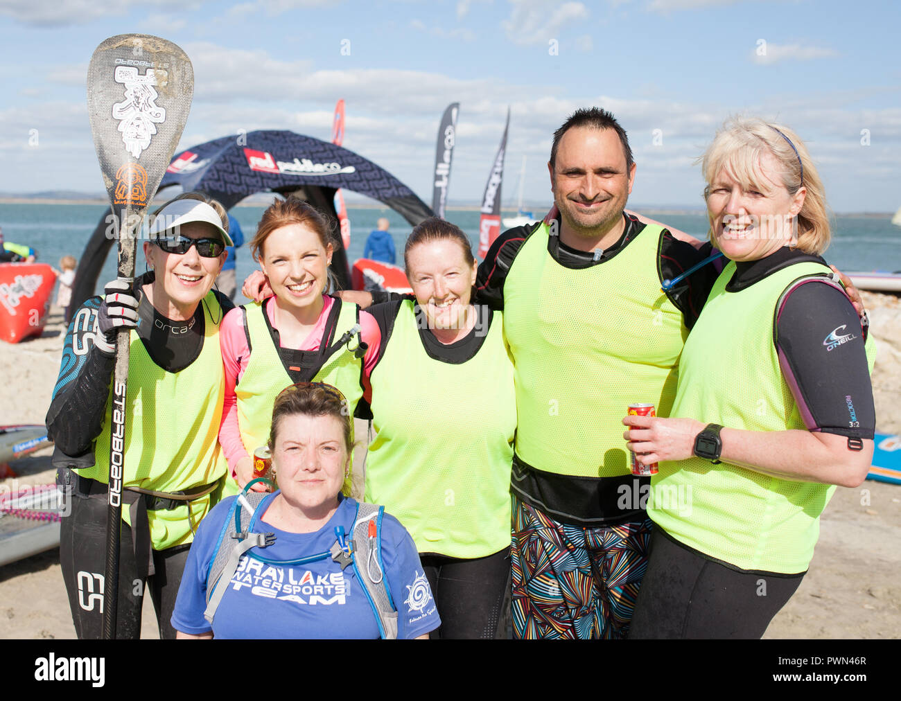 Group of children in wet suits hi-res stock photography and images - Alamy