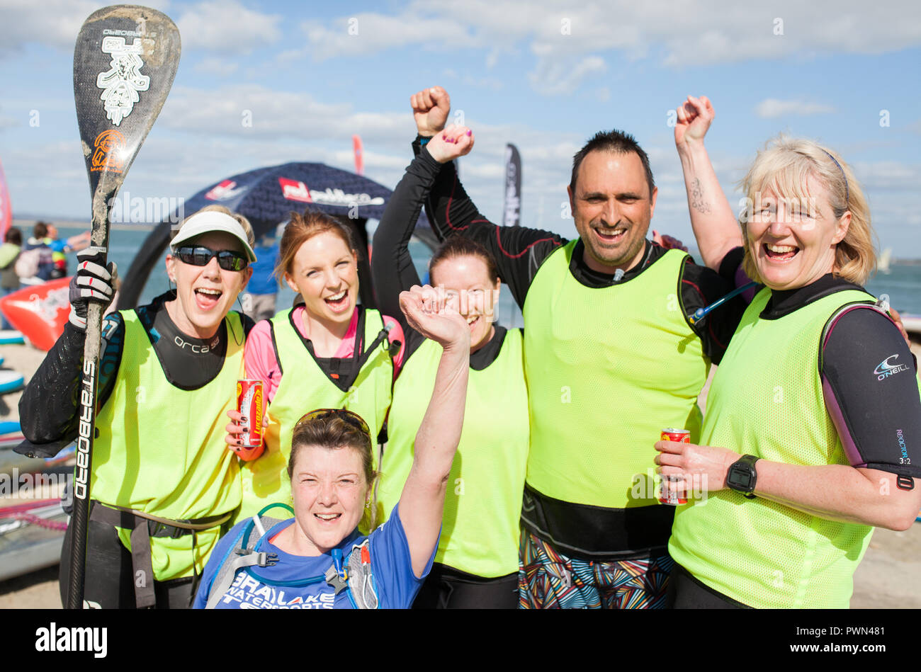 Group of children in wet suits hi-res stock photography and images - Alamy