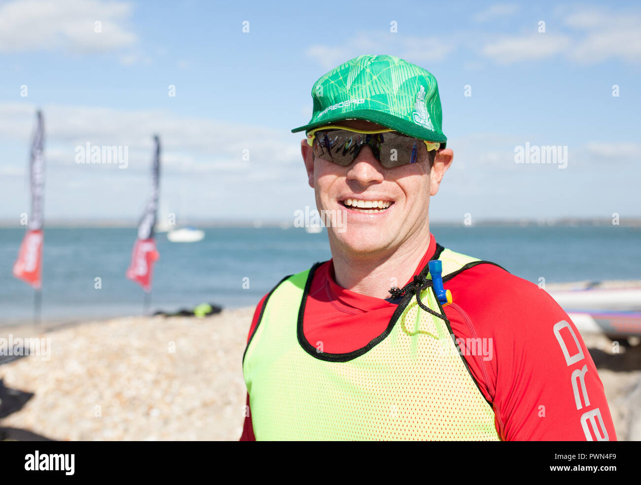 Paddle board winner finishing Stock Photo - Alamy