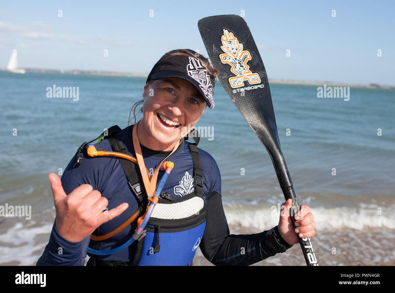 Female winner of a paddle board race Stock Photo - Alamy