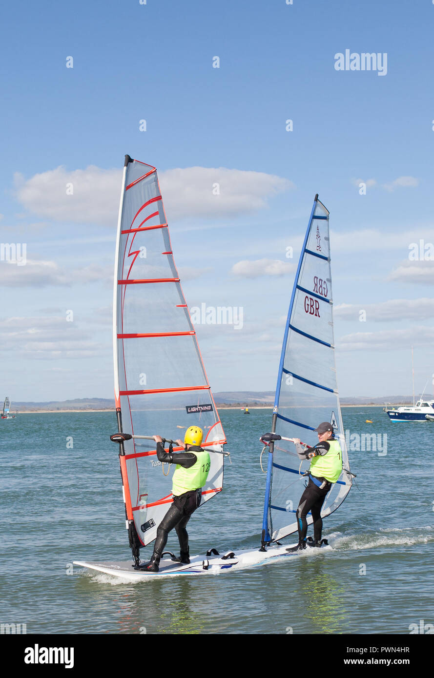 Tandem wind surfers finishing a race Stock Photo - Alamy