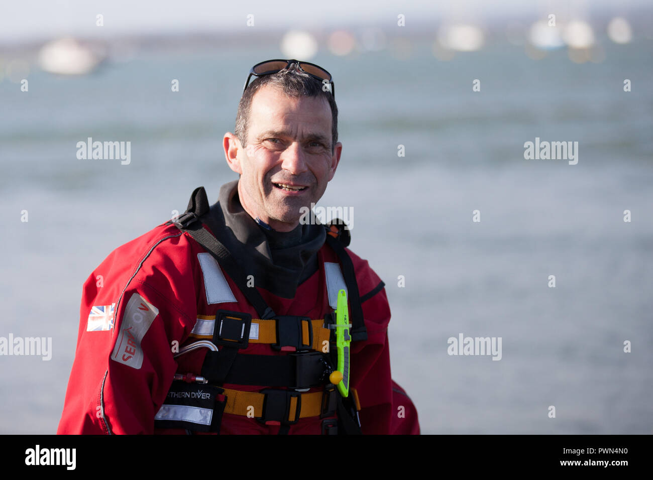 Portrait on location of a British Coast Guard worker Stock Photo - Alamy