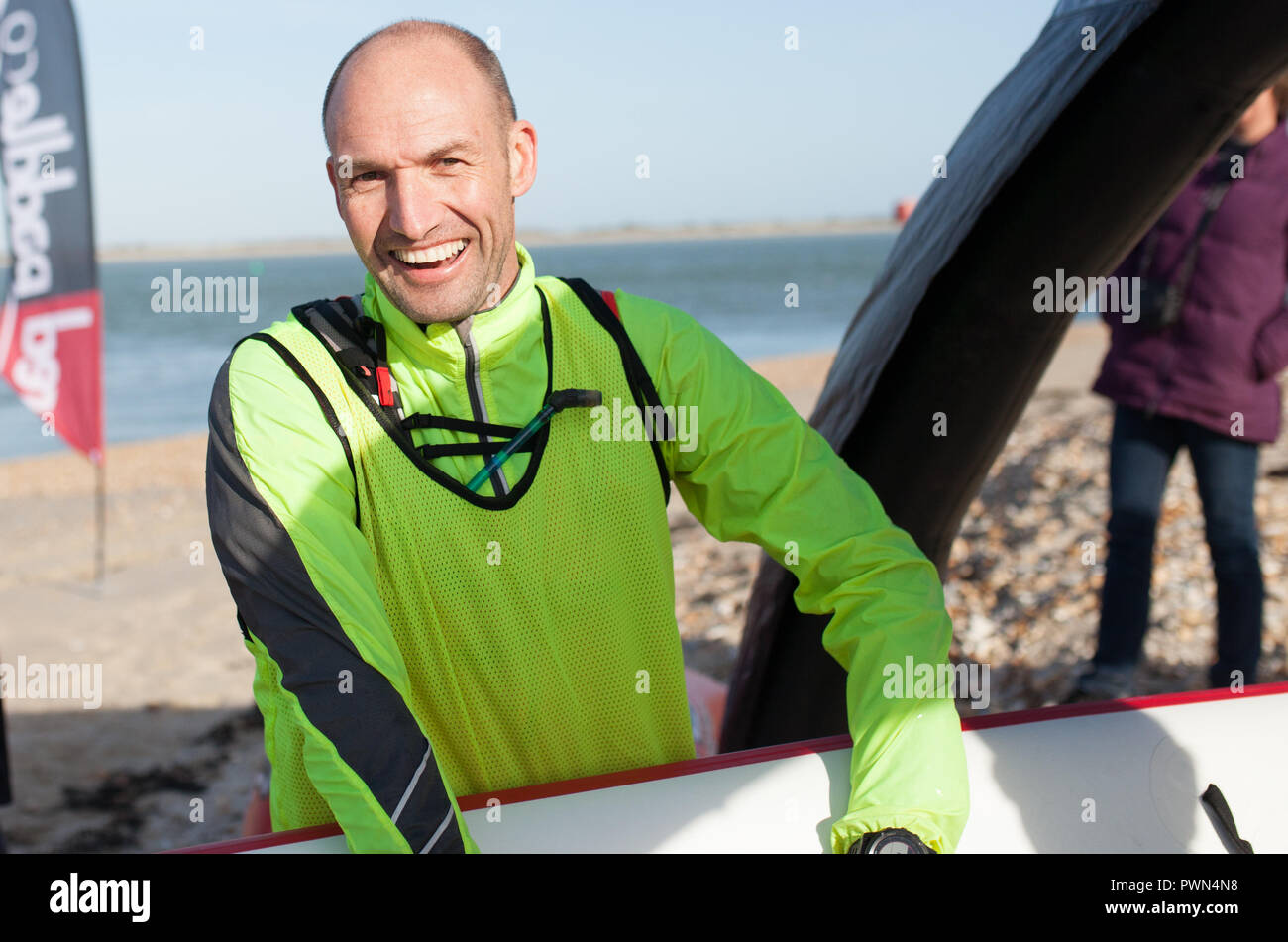 Portrait of an athlete while taking part in a paddle board race Stock ...