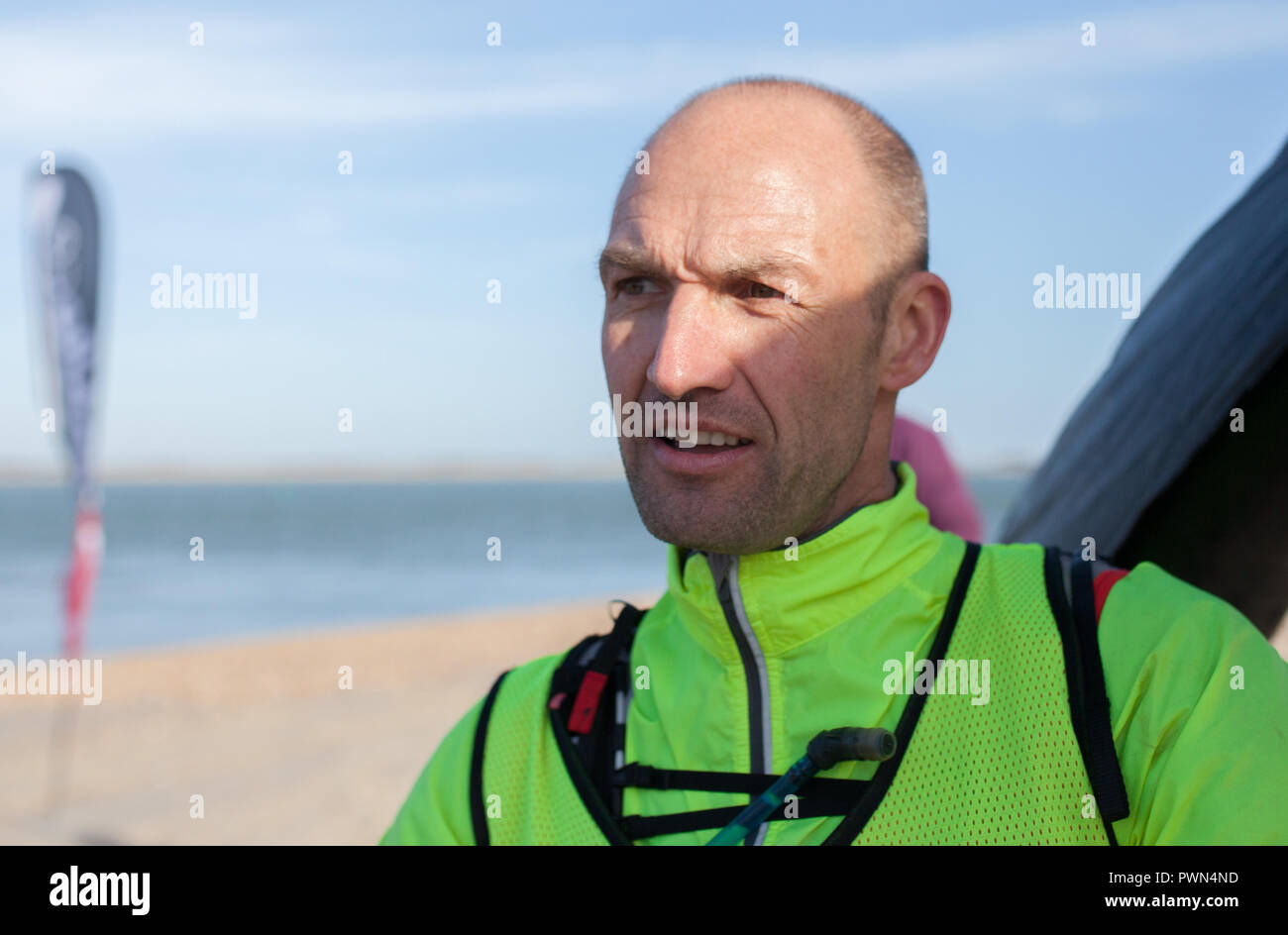 Portrait of an athlete while taking part in a paddle board race Stock ...