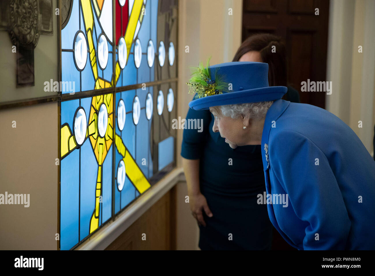 Queen Elizabeth II being shown the new stained-glass window during her ...