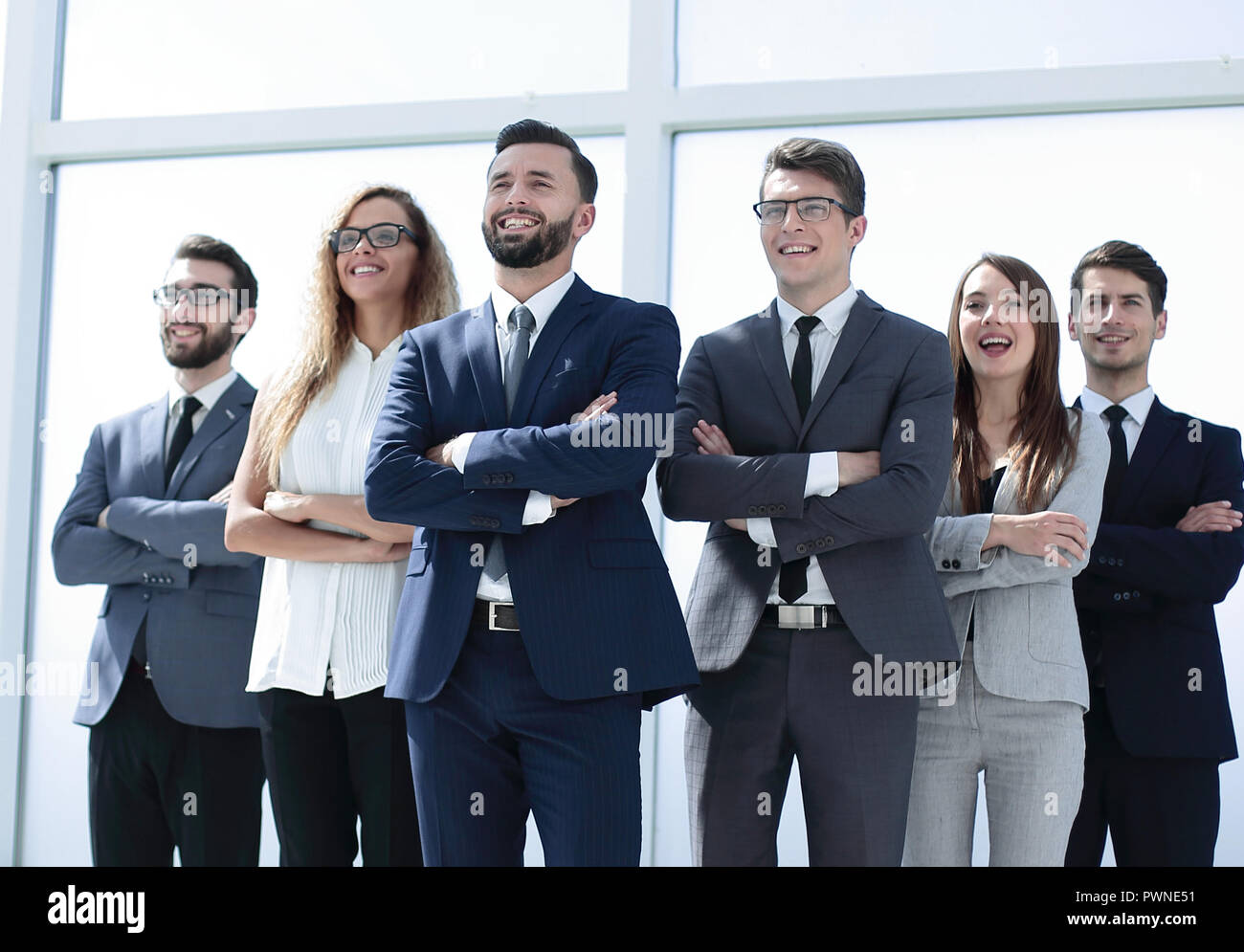 business team standing in new office Stock Photo - Alamy