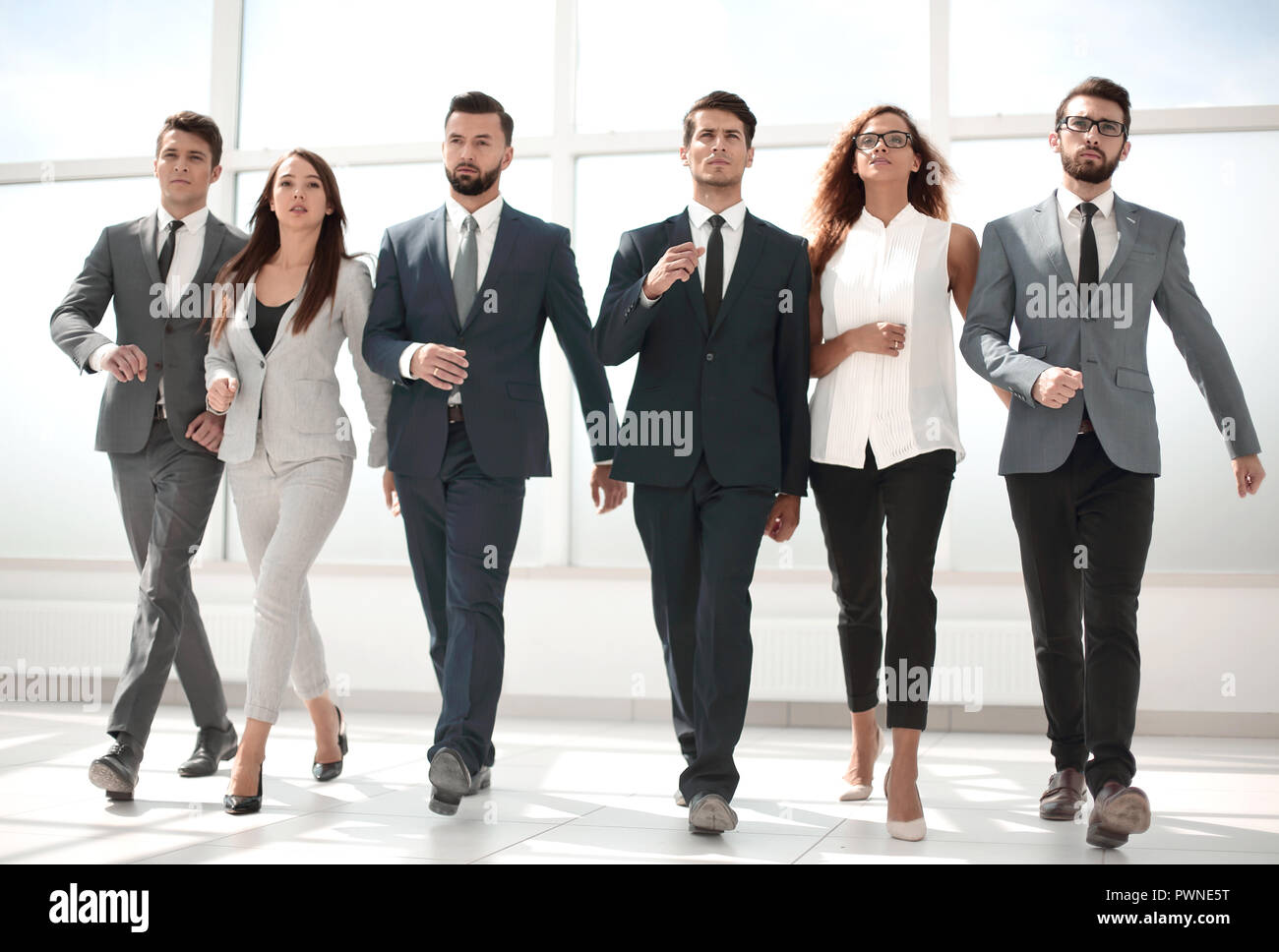 confident business team stepping forward Stock Photo - Alamy