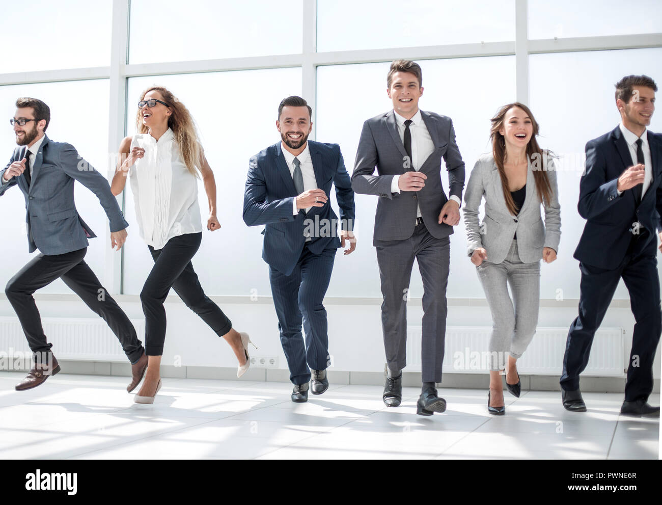 business team running together Stock Photo - Alamy