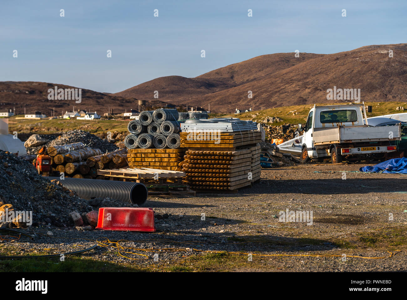 Materials like wood and metal parts in the Port of Leverburgh, Isle of ...