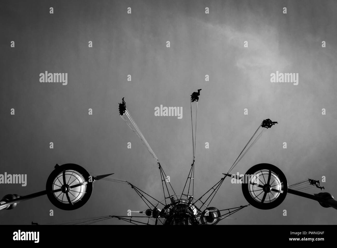 Colorful fairground ride in Black and White Stock Photos & Images - Alamy