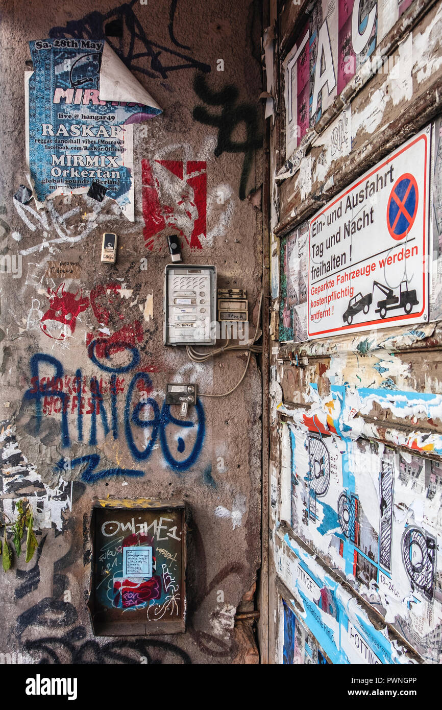 Urban Decay. Entrance to building with old doorbells, esposed wiring ...