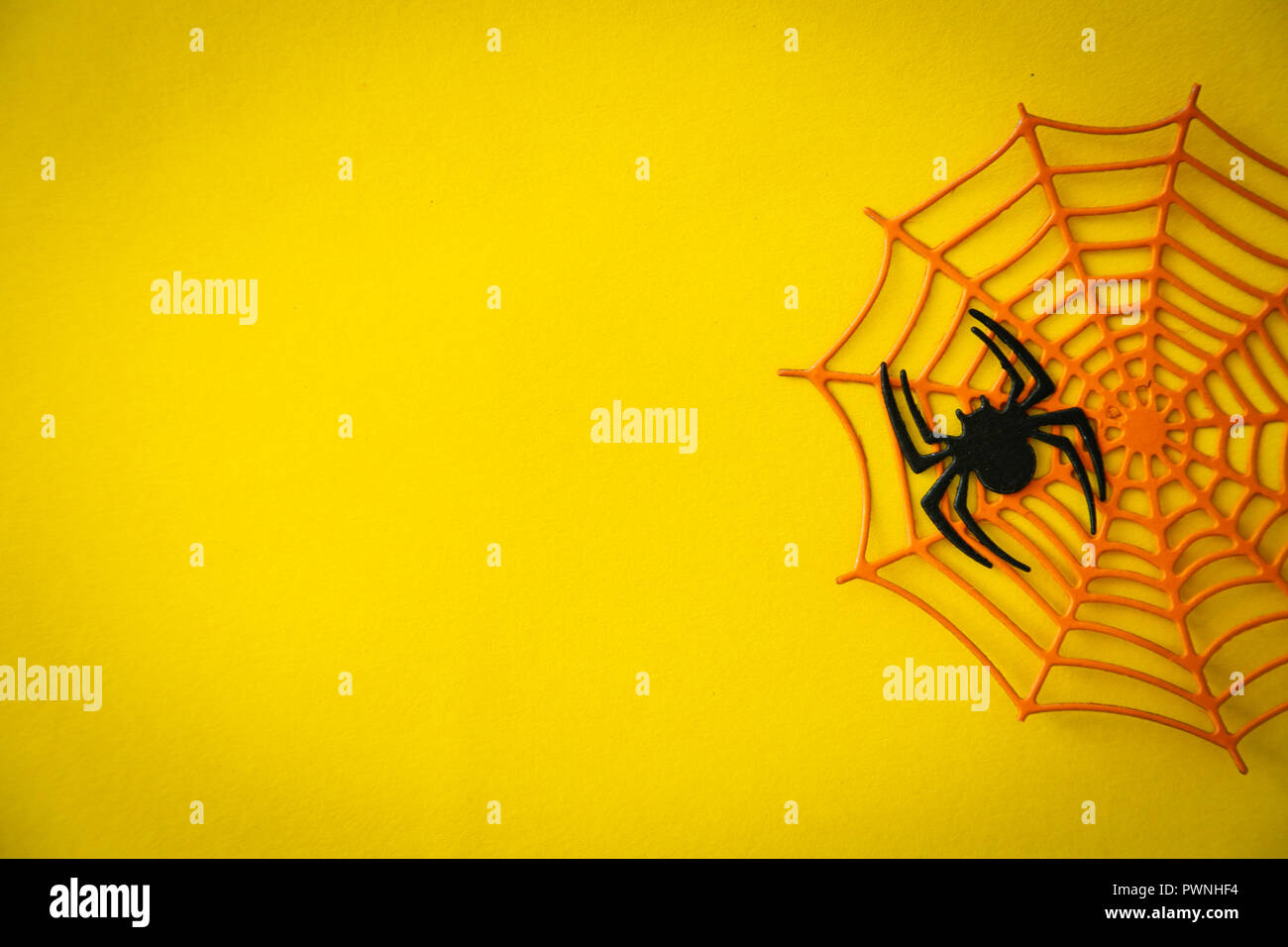 Halloween concept - spiders, bats, web paper crafts on bright ...