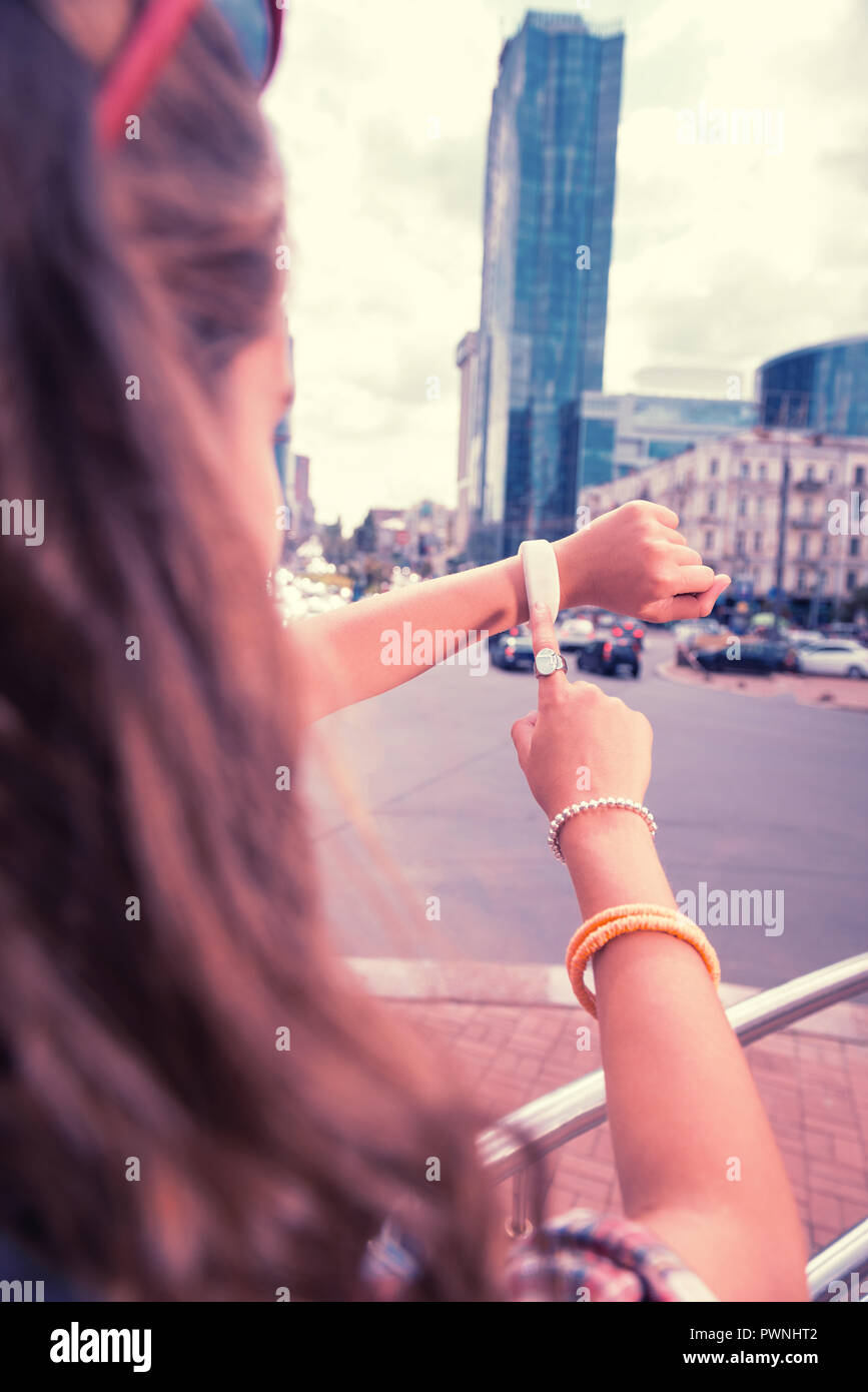 Hand wearing bracelets hi-res stock photography and images - Alamy