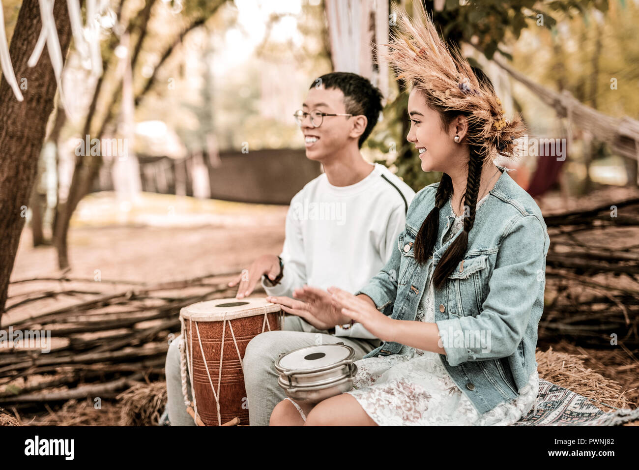 Relaxed international couple making melody with pleasure Stock Photo ...