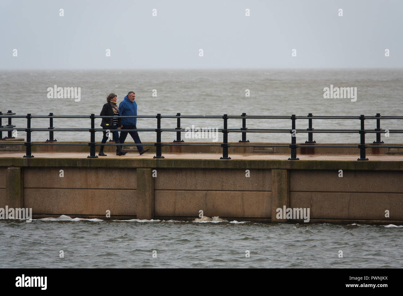 People walking windy day hi-res stock photography and images - Alamy