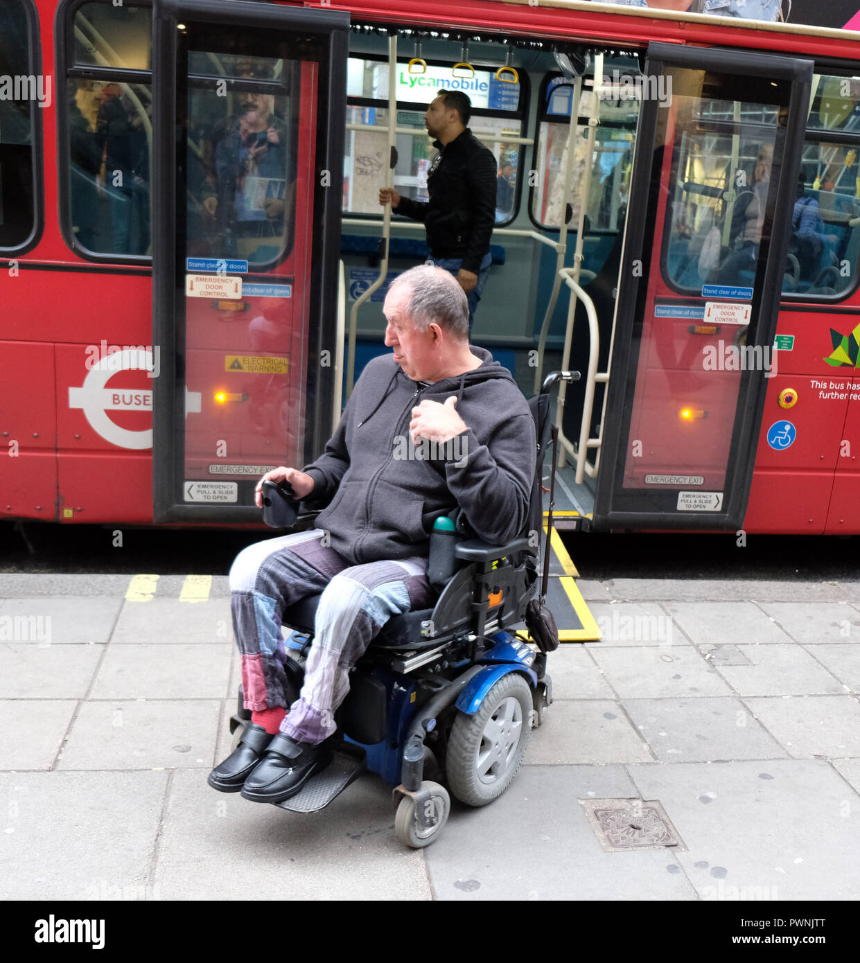 Pic shows: Man in a wheelchair trying to get on a bus pic by Gavin ...