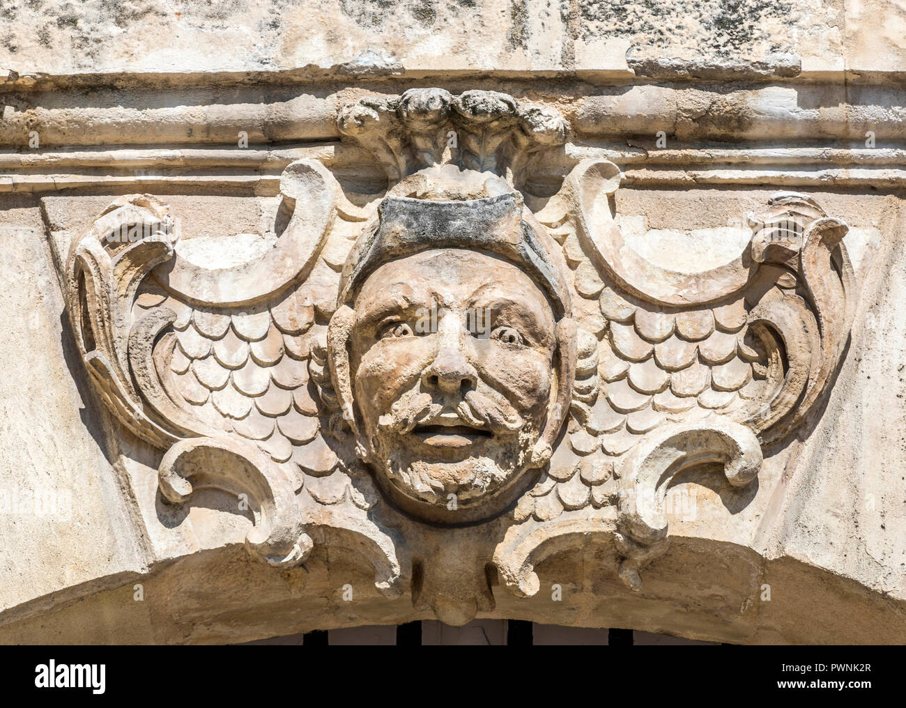 France, Gironde, Bordeaux, mascaron on the facade of a palace on the ...