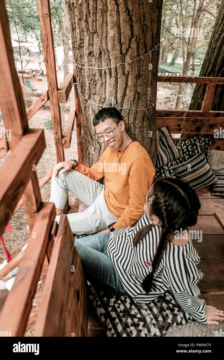 Positive delighted Asian people having rest together Stock Photo - Alamy