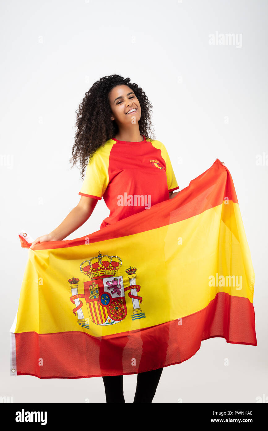 Portrait of a young supporter of the Spanish team wearing the national ...
