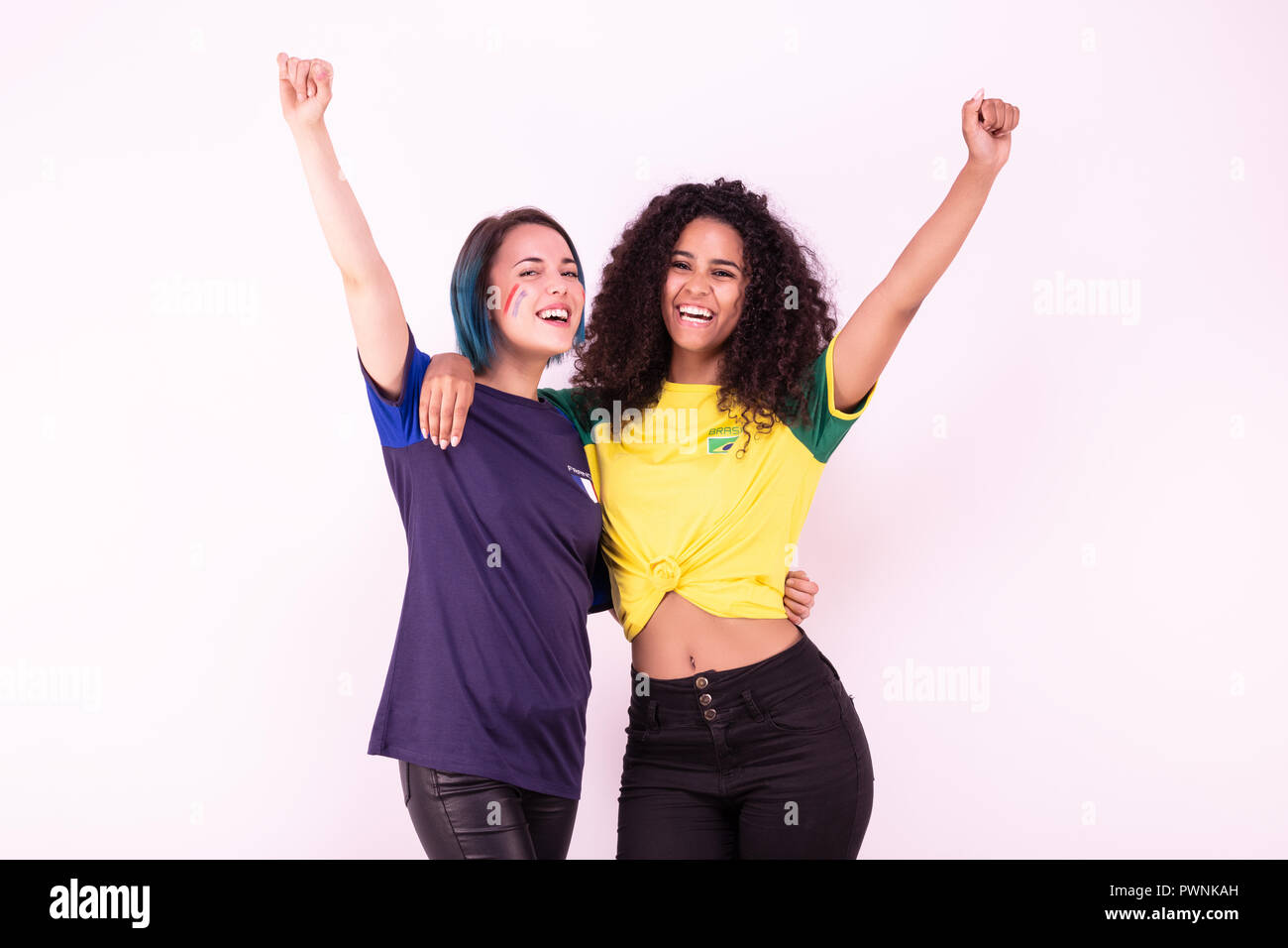 Portrait of two young fans of the Brazilian team and the French ...
