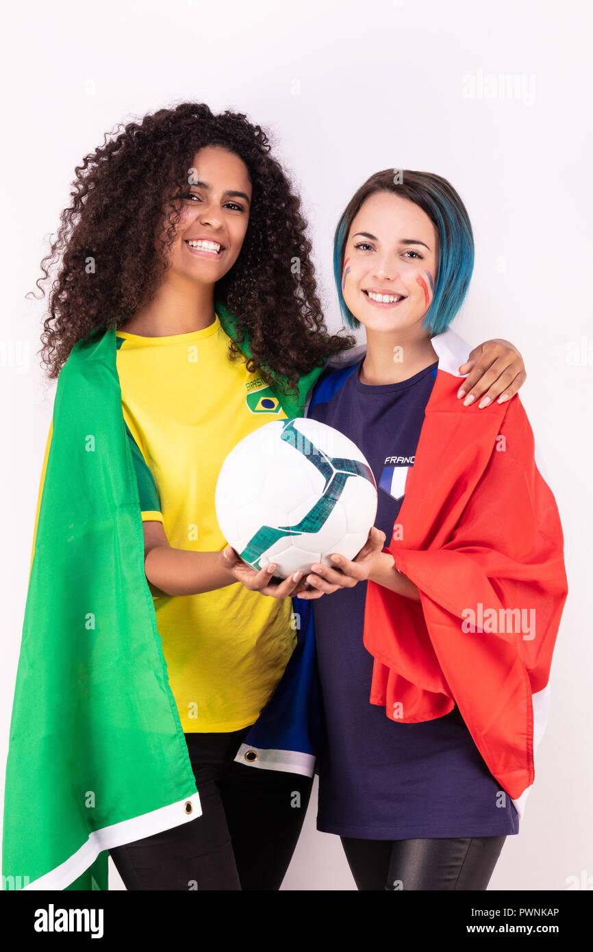 Portrait of two young fans of the Brazilian team and the French ...