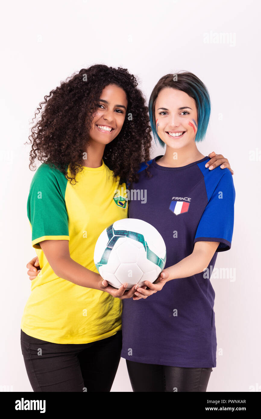 Portrait of two young fans of the Brazilian team and the French ...