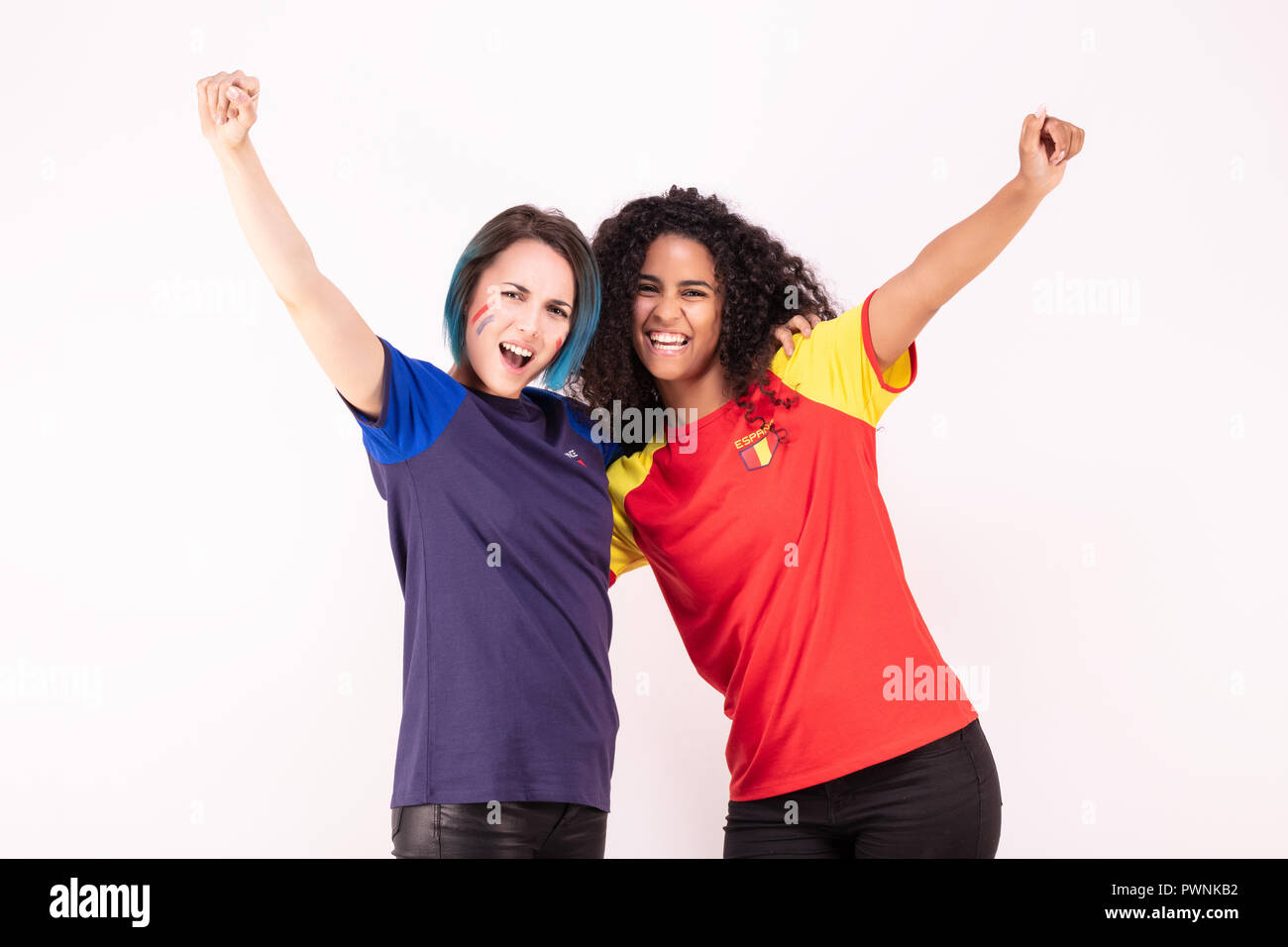 Portrait of two young fans of the Spanish team and the French ...