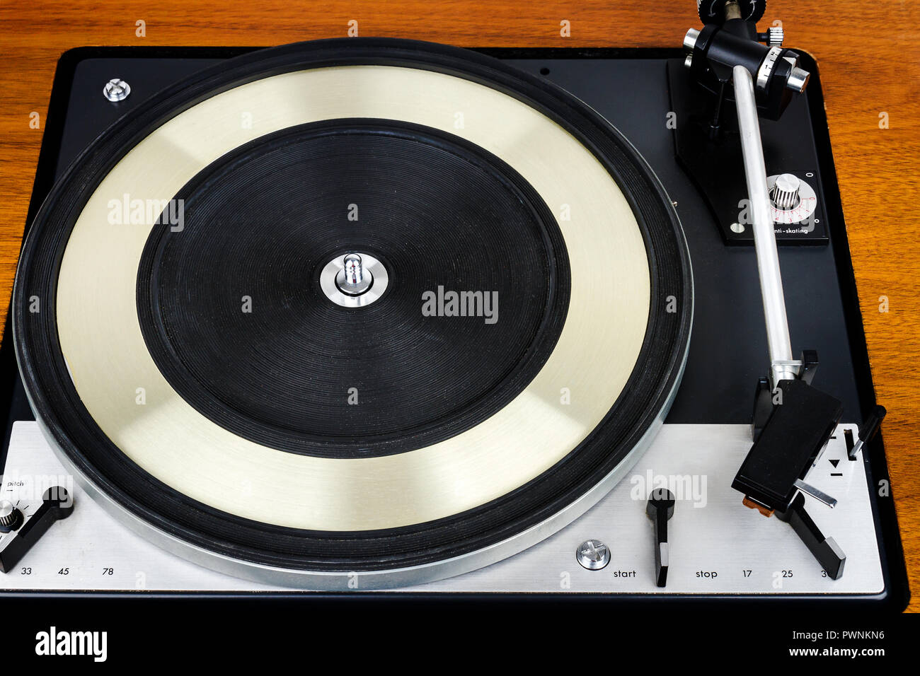 Close up of vintage turntable vinyl record player. Wooden plinth. Retro ...