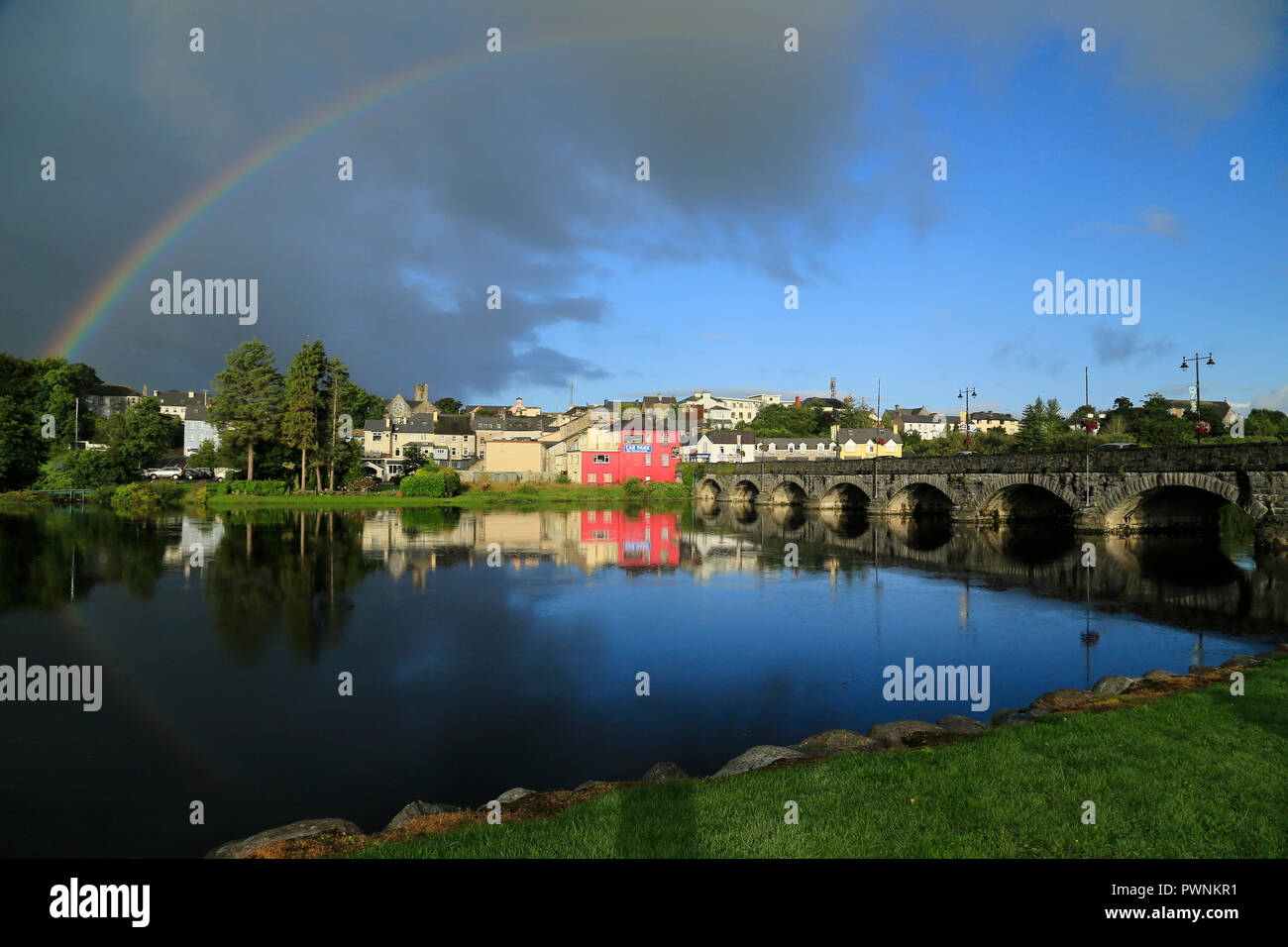 Irish rainbow reflected in the river Laune by the stone bridge in ...