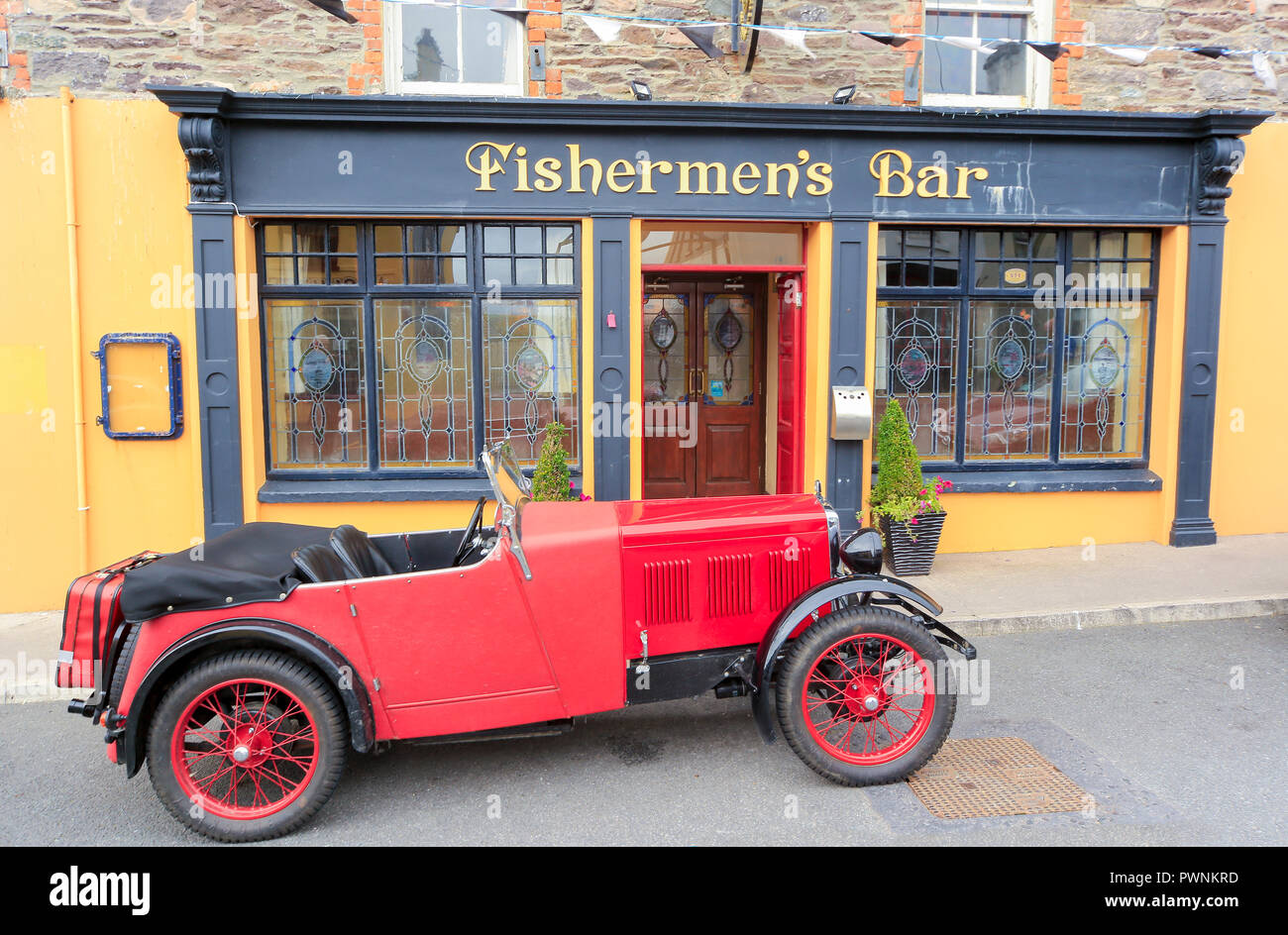 Vintage car outside Irish Pub Stock Photo - Alamy