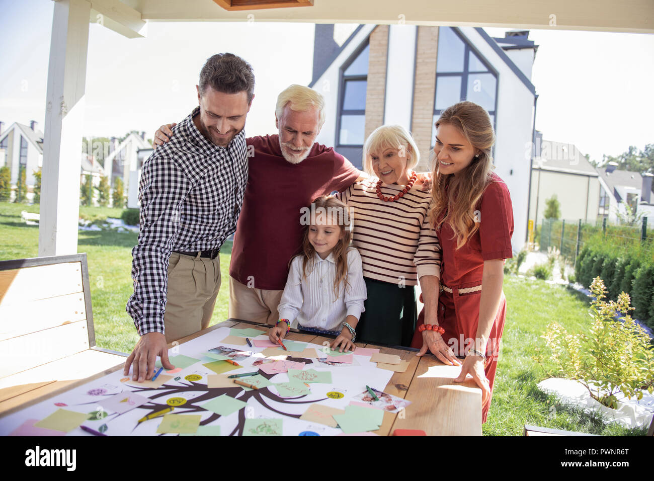 Happy family enjoying the result of their task Stock Photo - Alamy