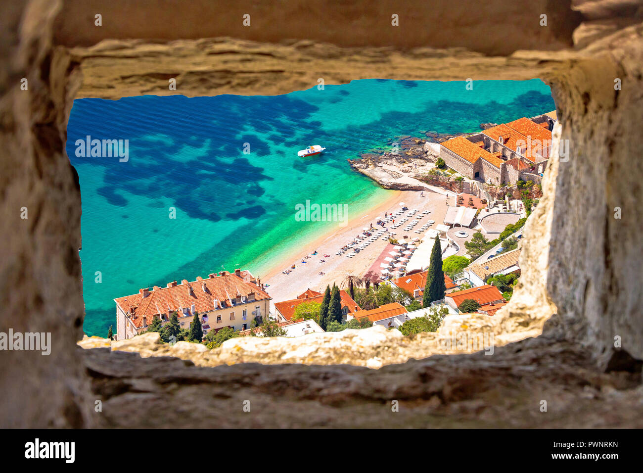 Banje beach in Dubrovnik aerial view through stone window, Dalmatia ...