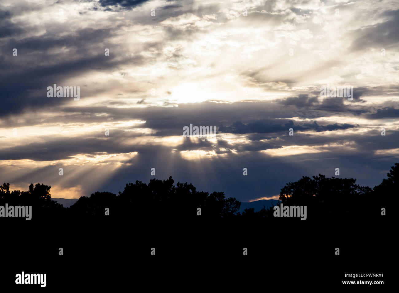 Sunset through beautiful religious clouds in the Sangre de Cristo ...