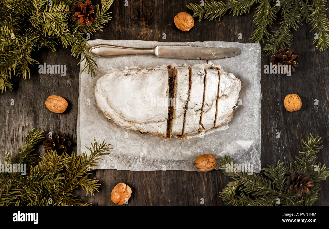 Traditional German Christmas fruit cake stollen on a dark background ...
