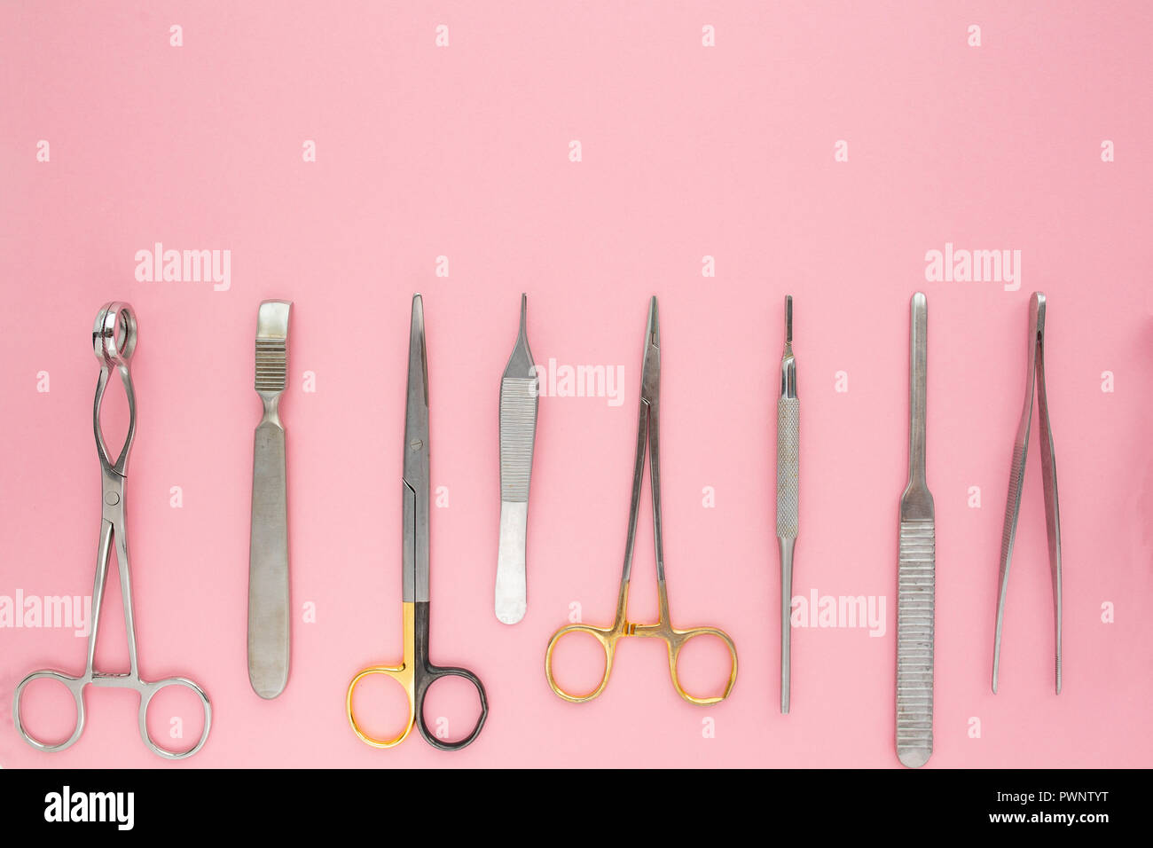 Flat lay of medical instruments on rose background Stock Photo - Alamy