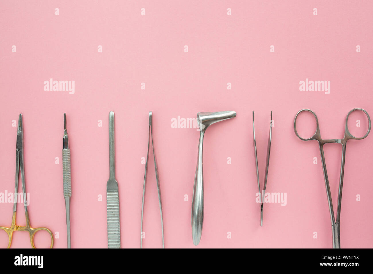 Flat lay of medical instruments on rose background Stock Photo - Alamy