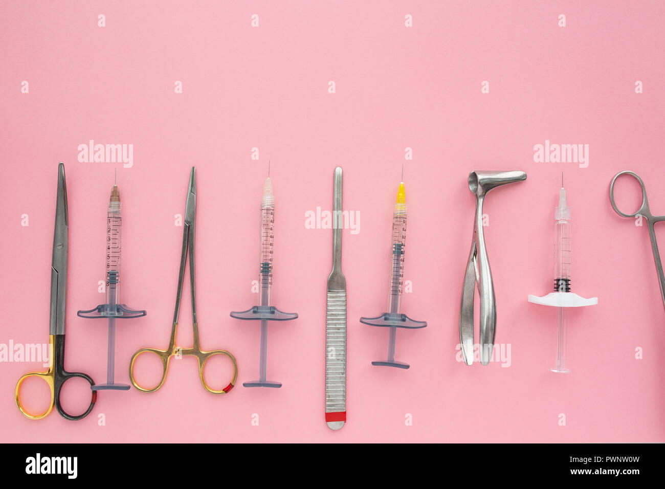 Flat lay of medical instruments on rose background Stock Photo - Alamy